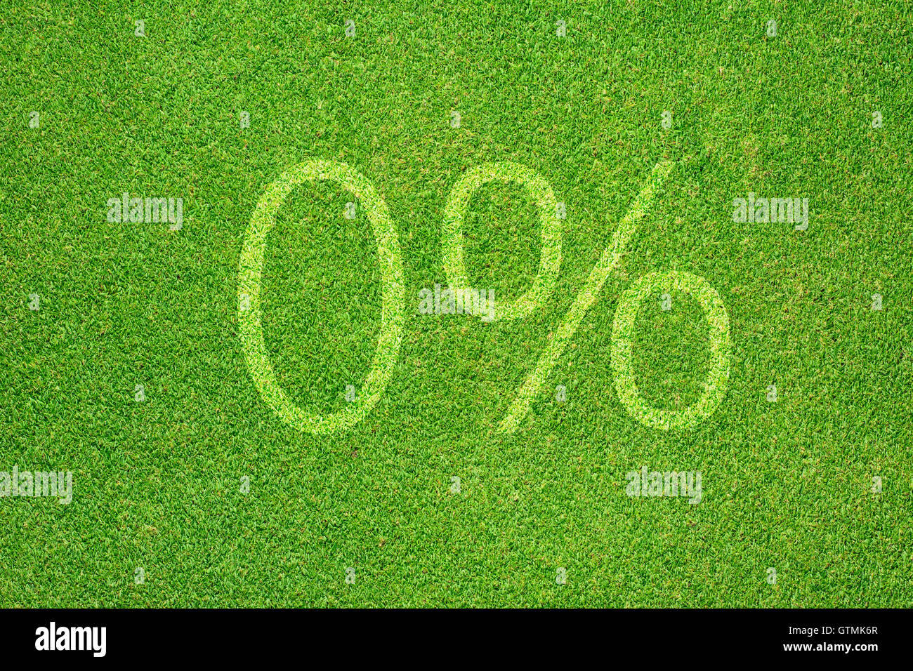 Percent icon on green grass texture and background Stock Photo - Alamy