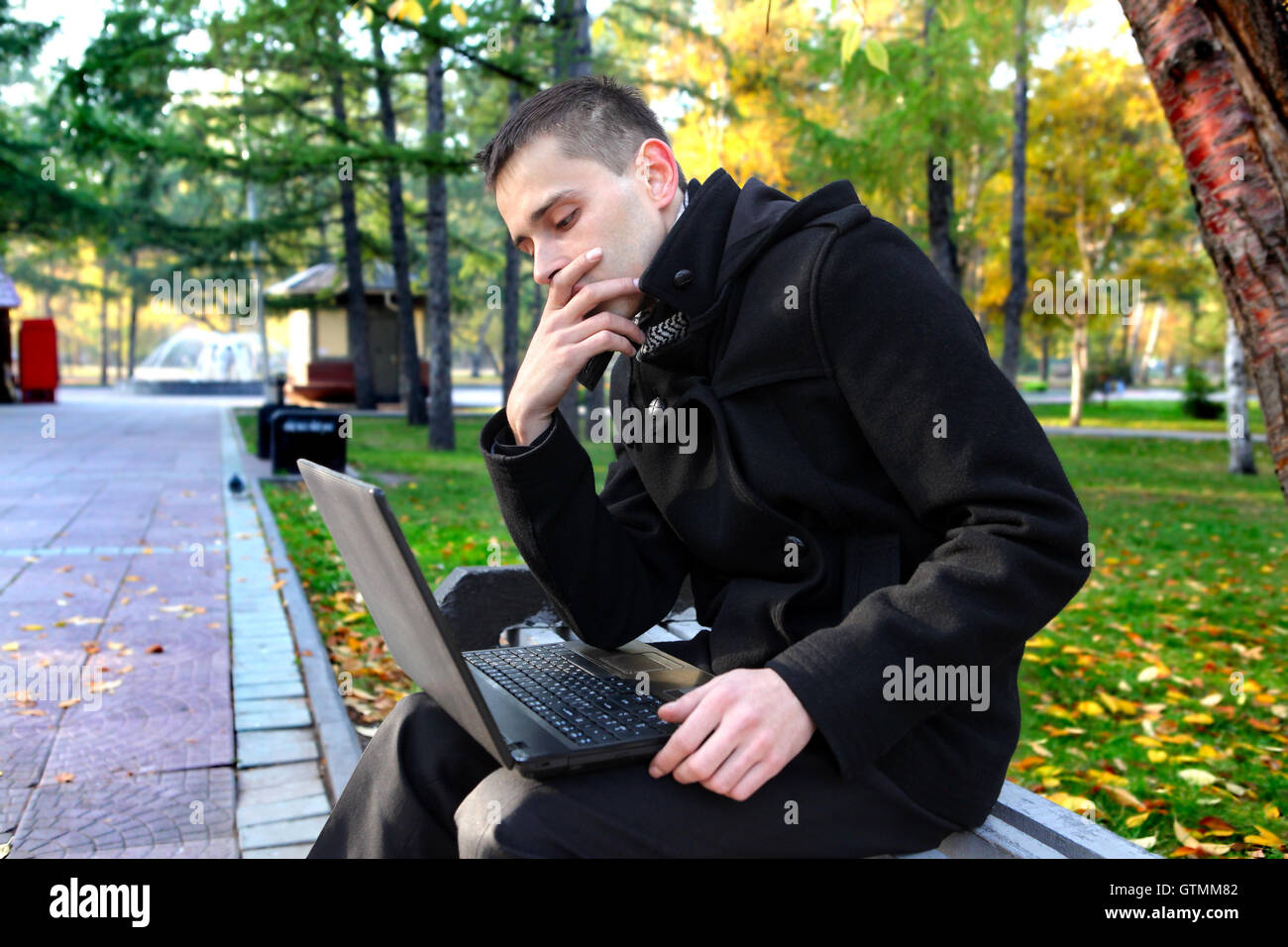 Man with Laptop Outdoor Stock Photo - Alamy