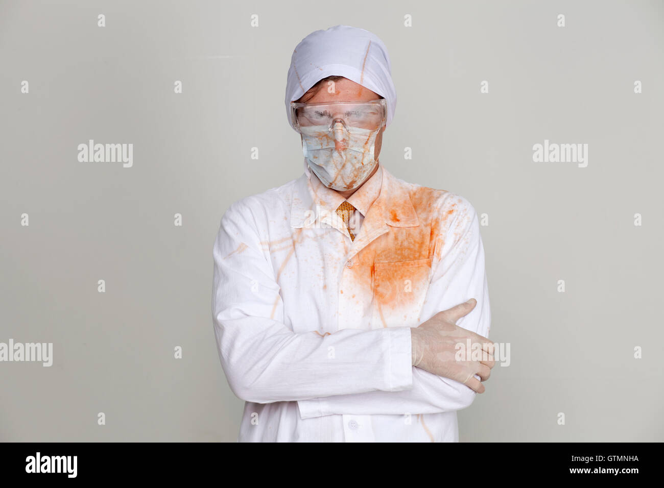 Doctor in a bloody robe Stock Photo - Alamy