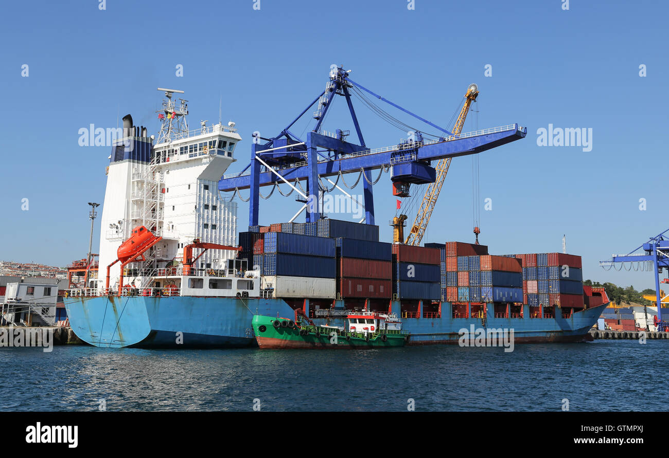 Container Ship is loading in a port Stock Photo - Alamy