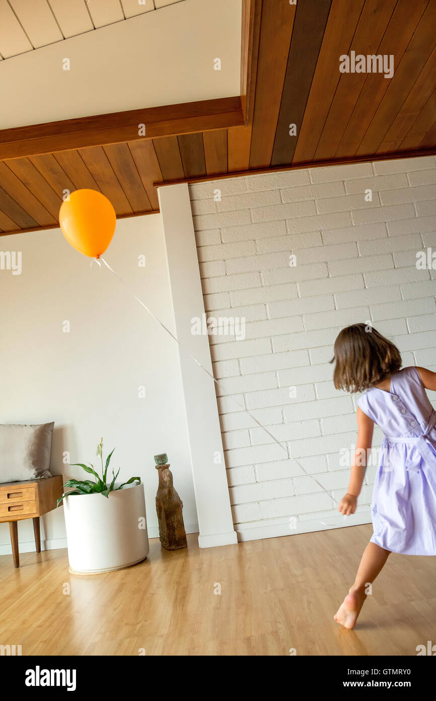 Four year old girl playing with her balloon Stock Photo - Alamy