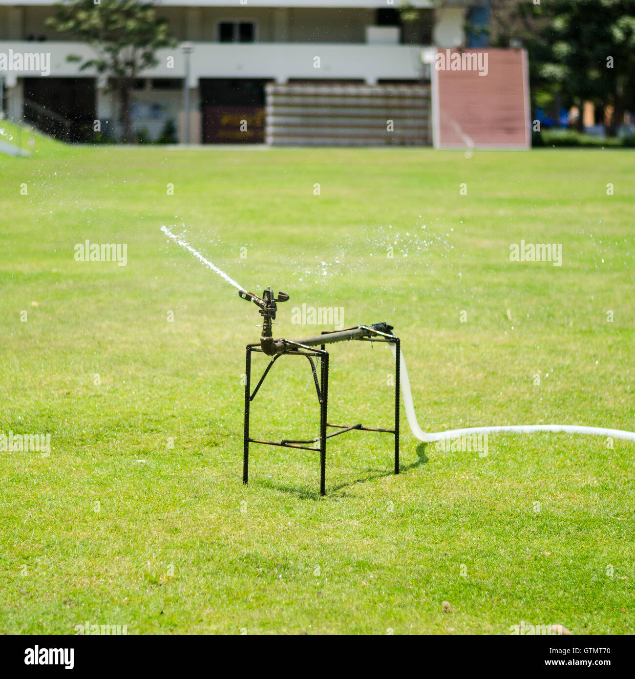 watering in football field Stock Photo - Alamy