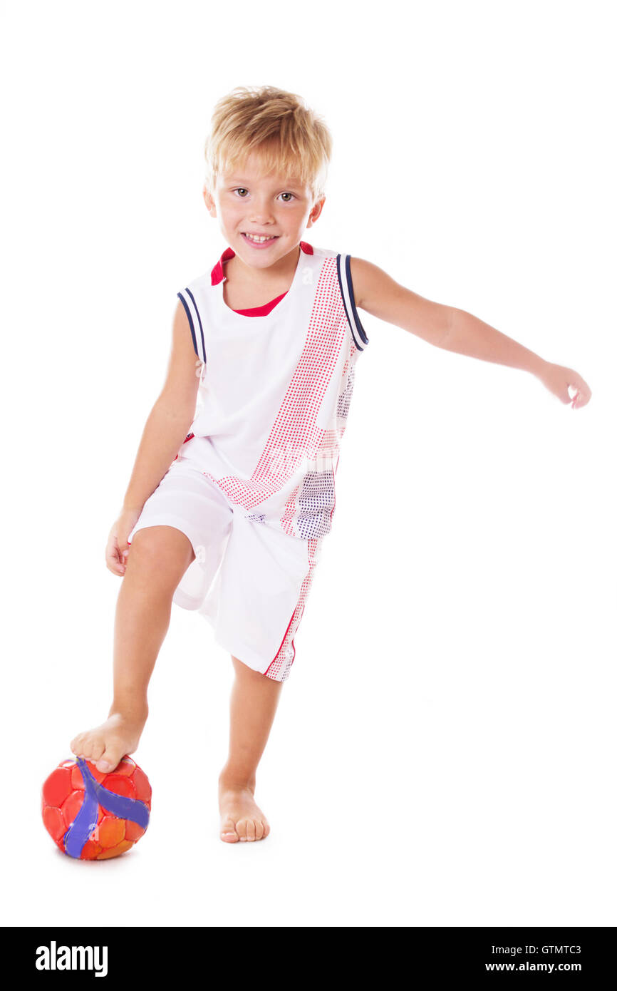 Small football player with ball Stock Photo - Alamy