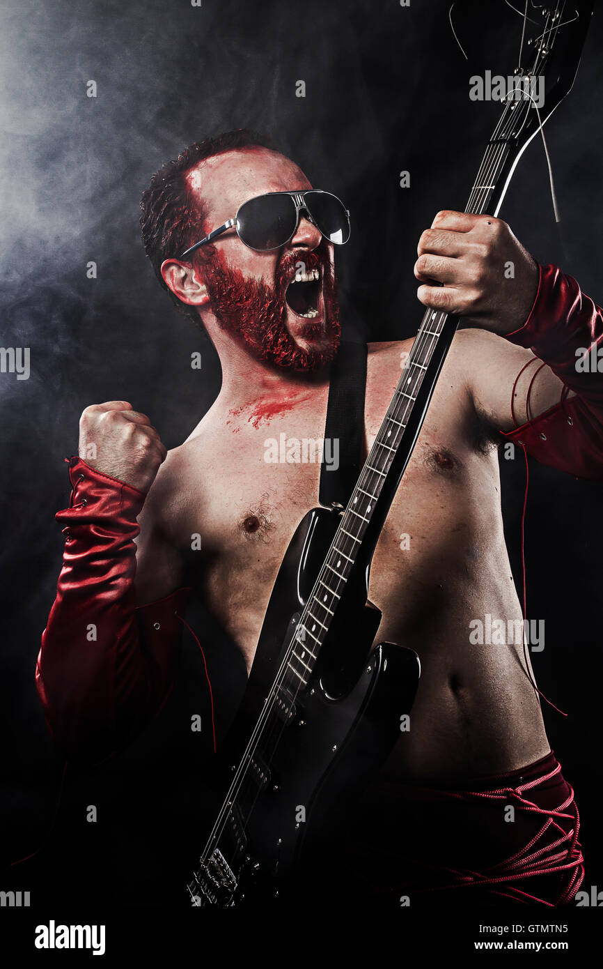 Rock star playing solo on guitar. man performing electrical musi Stock ...