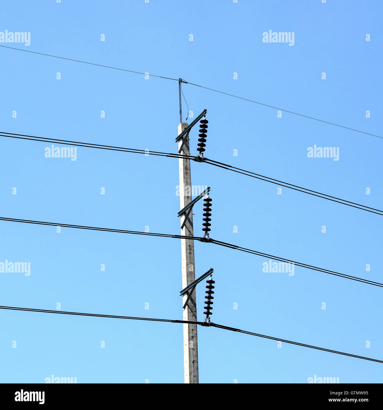 Electricity post on blue sky Stock Photo - Alamy