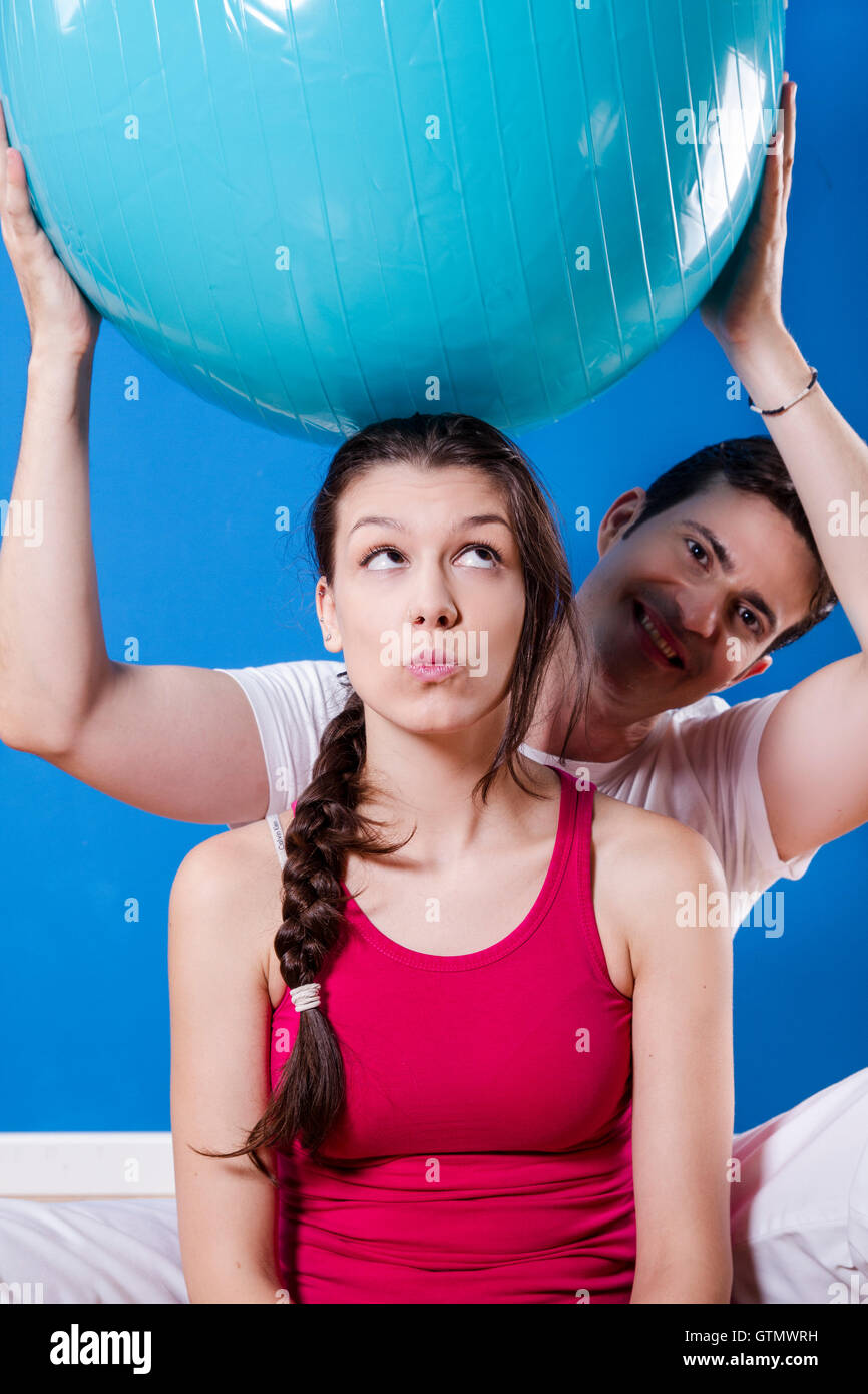 Happy athletic couple with fitness ball Stock Photo - Alamy