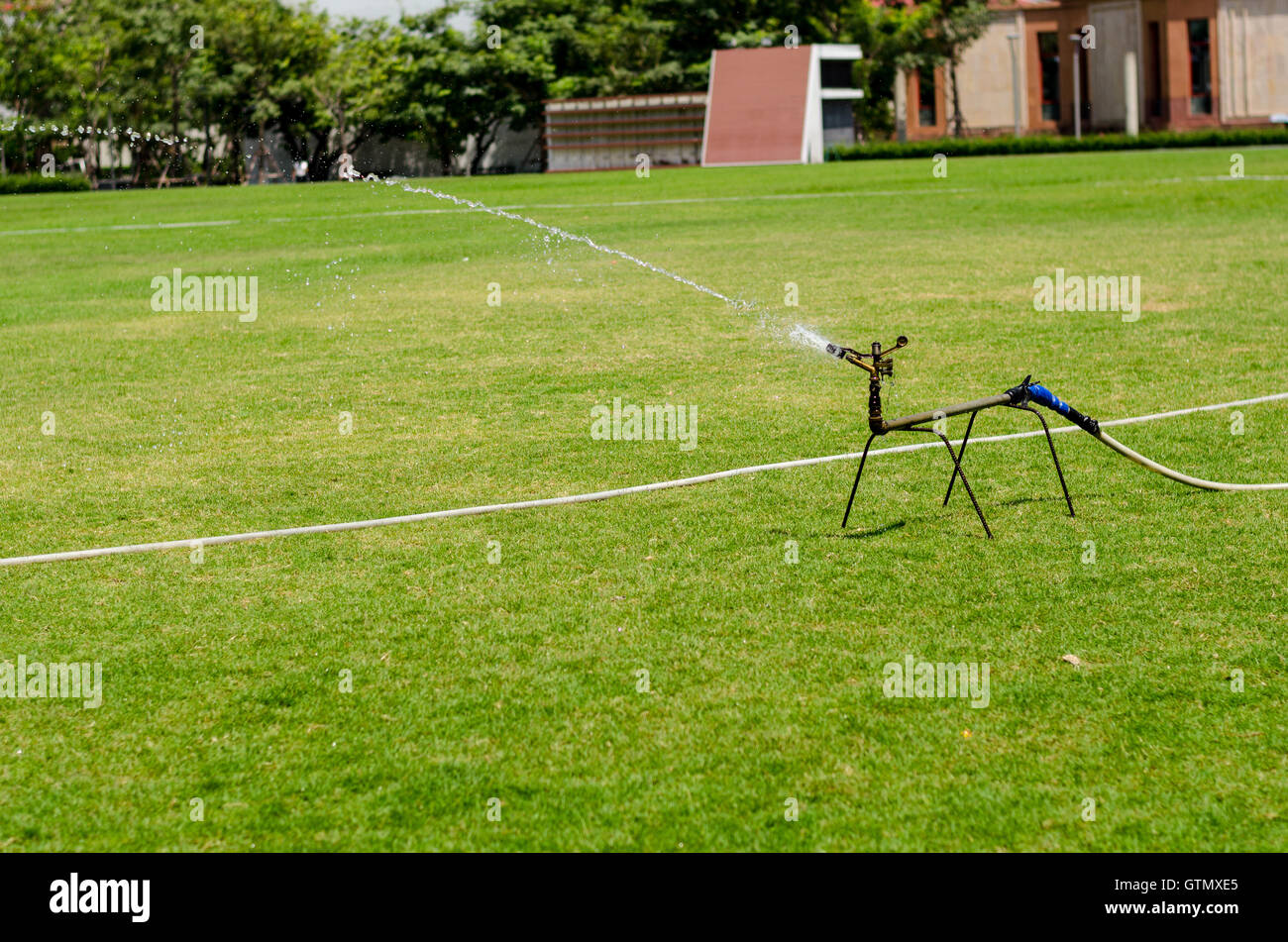 watering in football field Stock Photo - Alamy