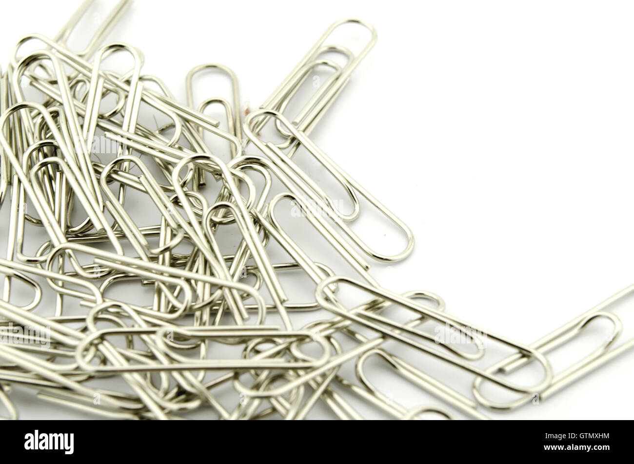 many clips isolated on white Stock Photo - Alamy