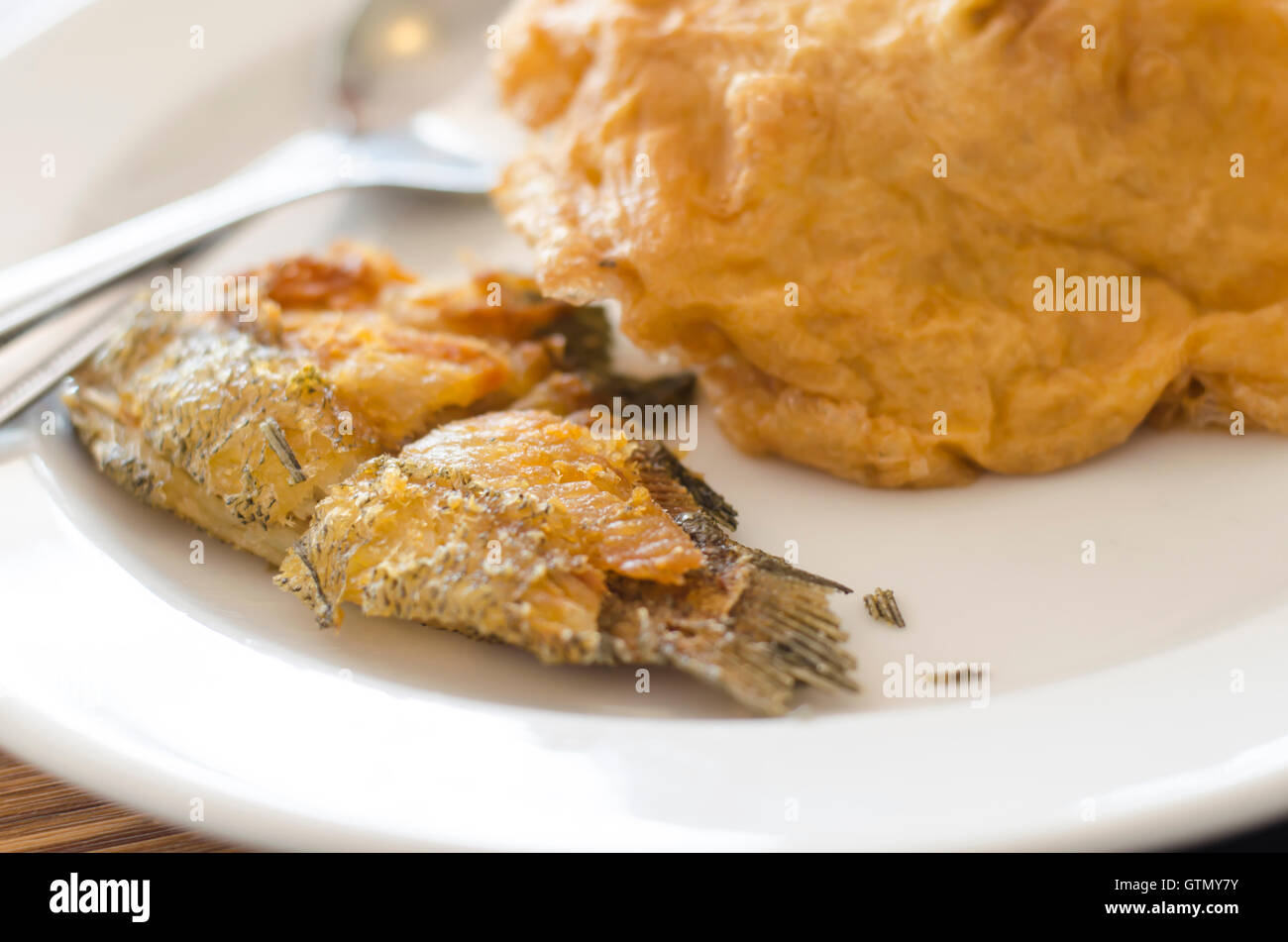 fried fish and omelet in dish Stock Photo - Alamy
