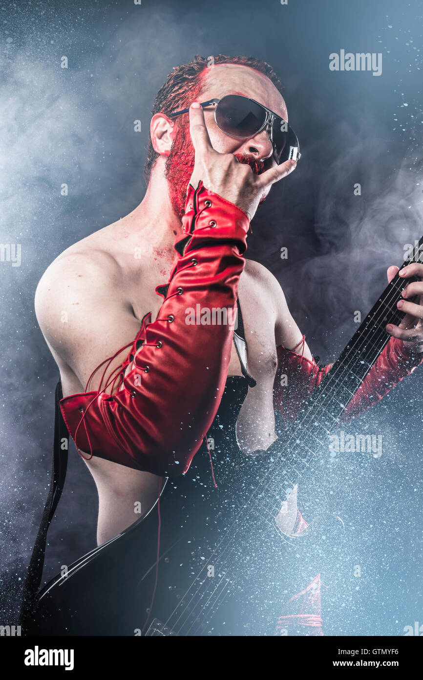 Rock star playing solo on guitar. heavy metal Stock Photo - Alamy