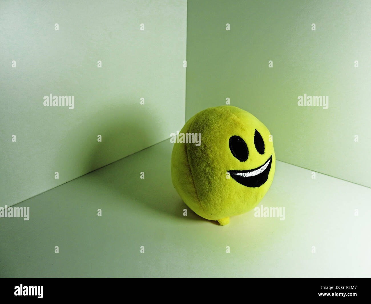 Yellow round slime with small legs Stock Photo - Alamy
