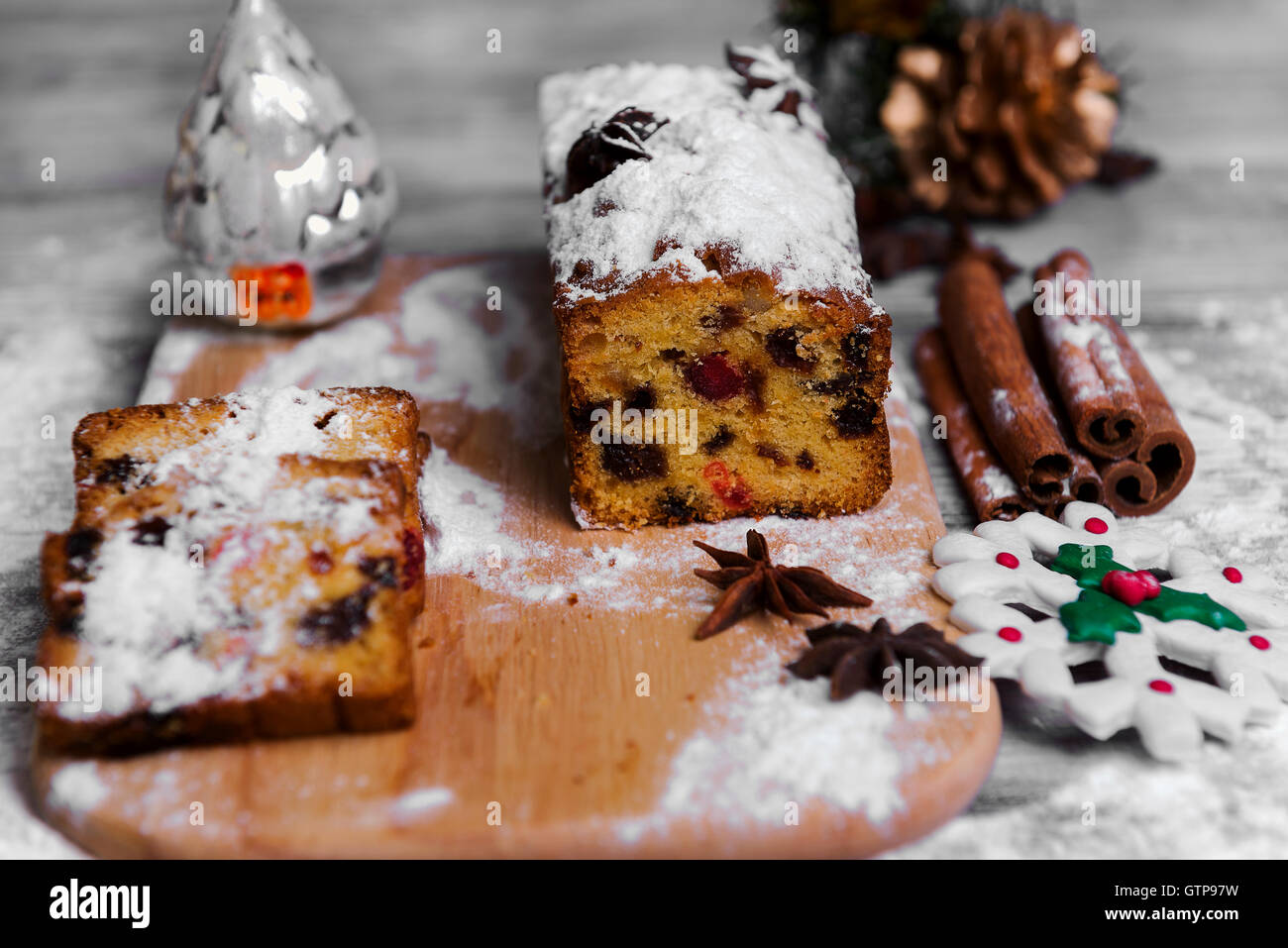On a wooden desk background Christmas stollen Stollen, a Christmas tree ...