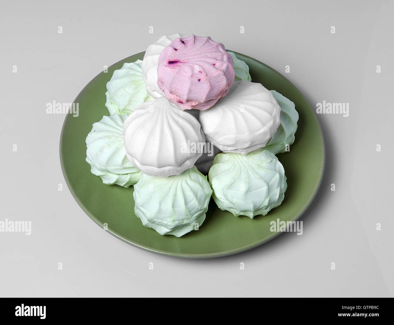 Green, white and purple marshmallow in a green plate Stock Photo - Alamy