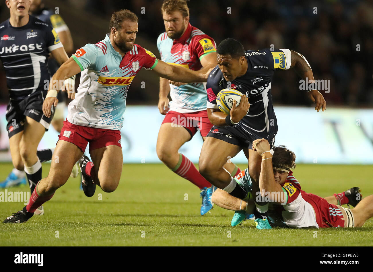 Sale Sharks' Johnny Leotau is tackled by Harlequins' Jack Clifford ...