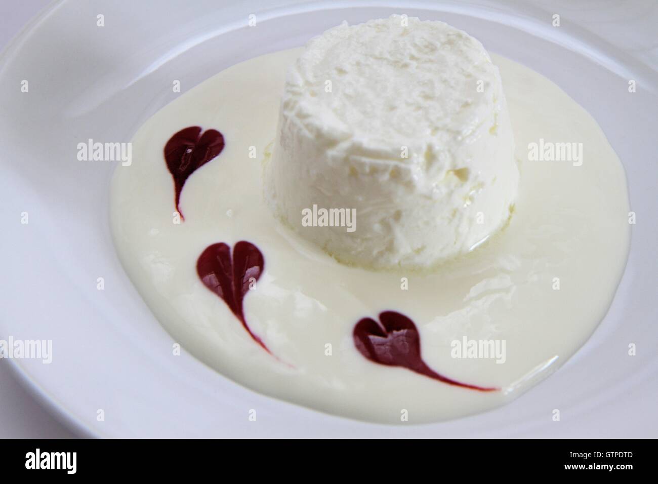 Faisselle with raspberry coulis Stock Photo - Alamy
