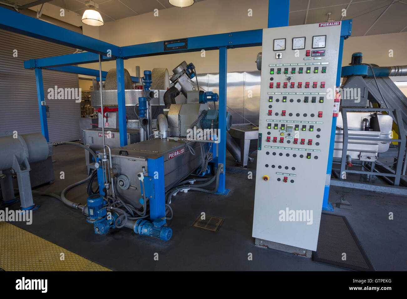 Pieralisi olive press, stone grinder, grinding harvested olives, Round ...