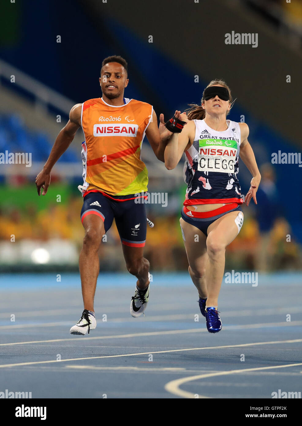 Great Britain's Libby Clegg and guide Chris Clarke celebrate winning ...