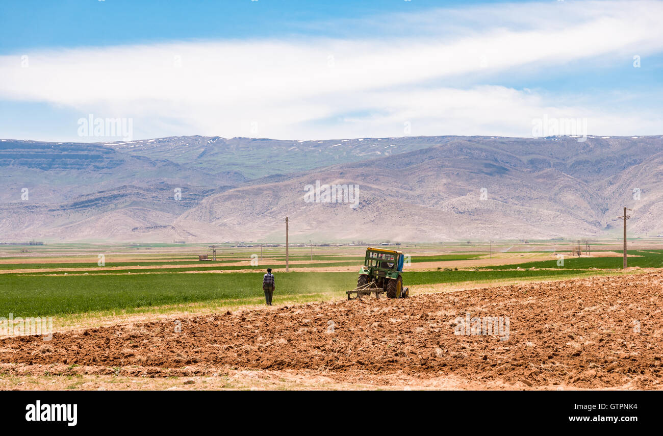 Farmer discing his fields in rural Fars Province, Iran, with John Deere ...
