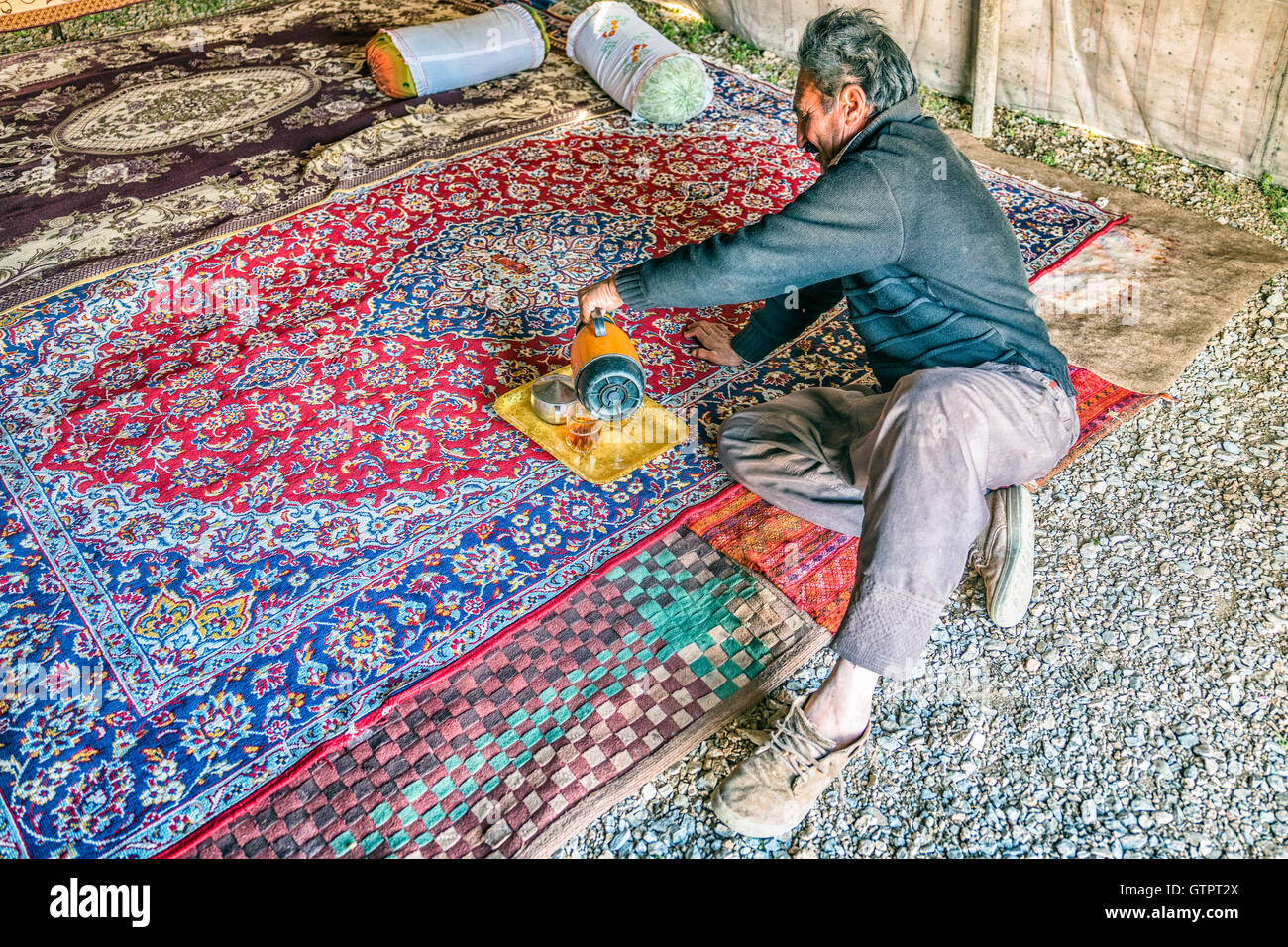 Aziz Gol, nomadic Basseri man, pours tea for his visitors. The Basseri ...