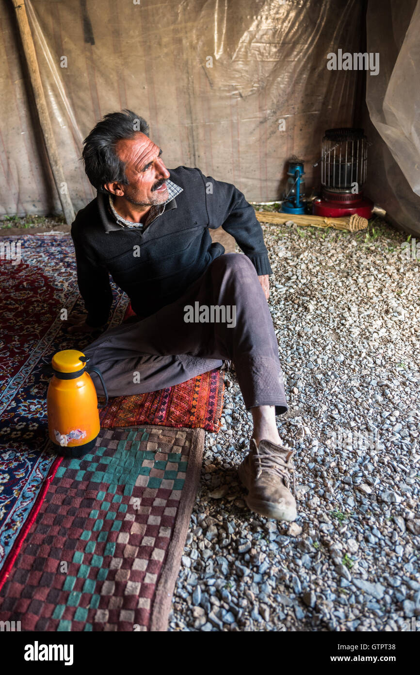 Aziz Gol, nomadic Basseri man in his family tent. The Basseri are a ...