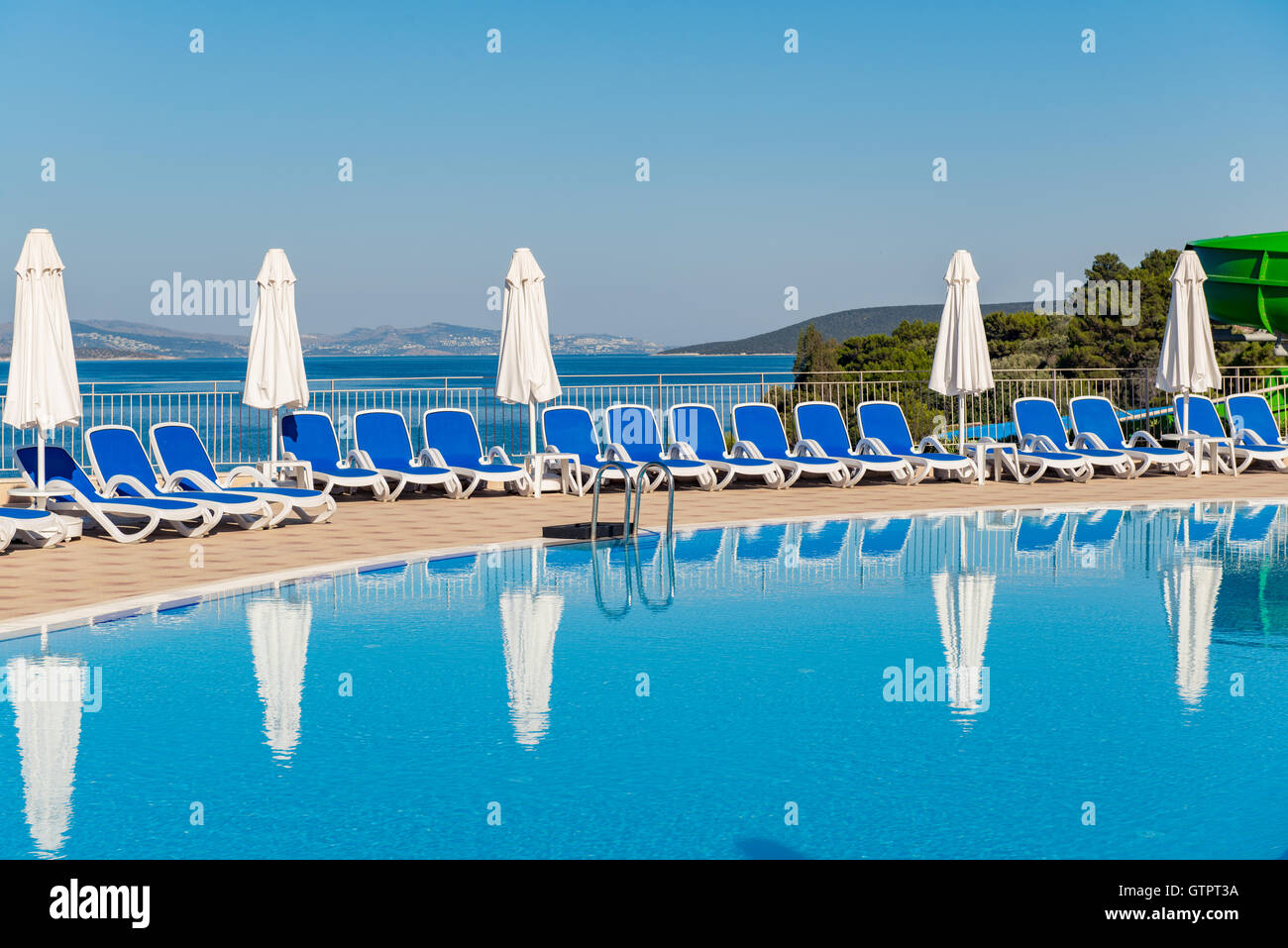 Swimming pool on bright summer day Stock Photo - Alamy