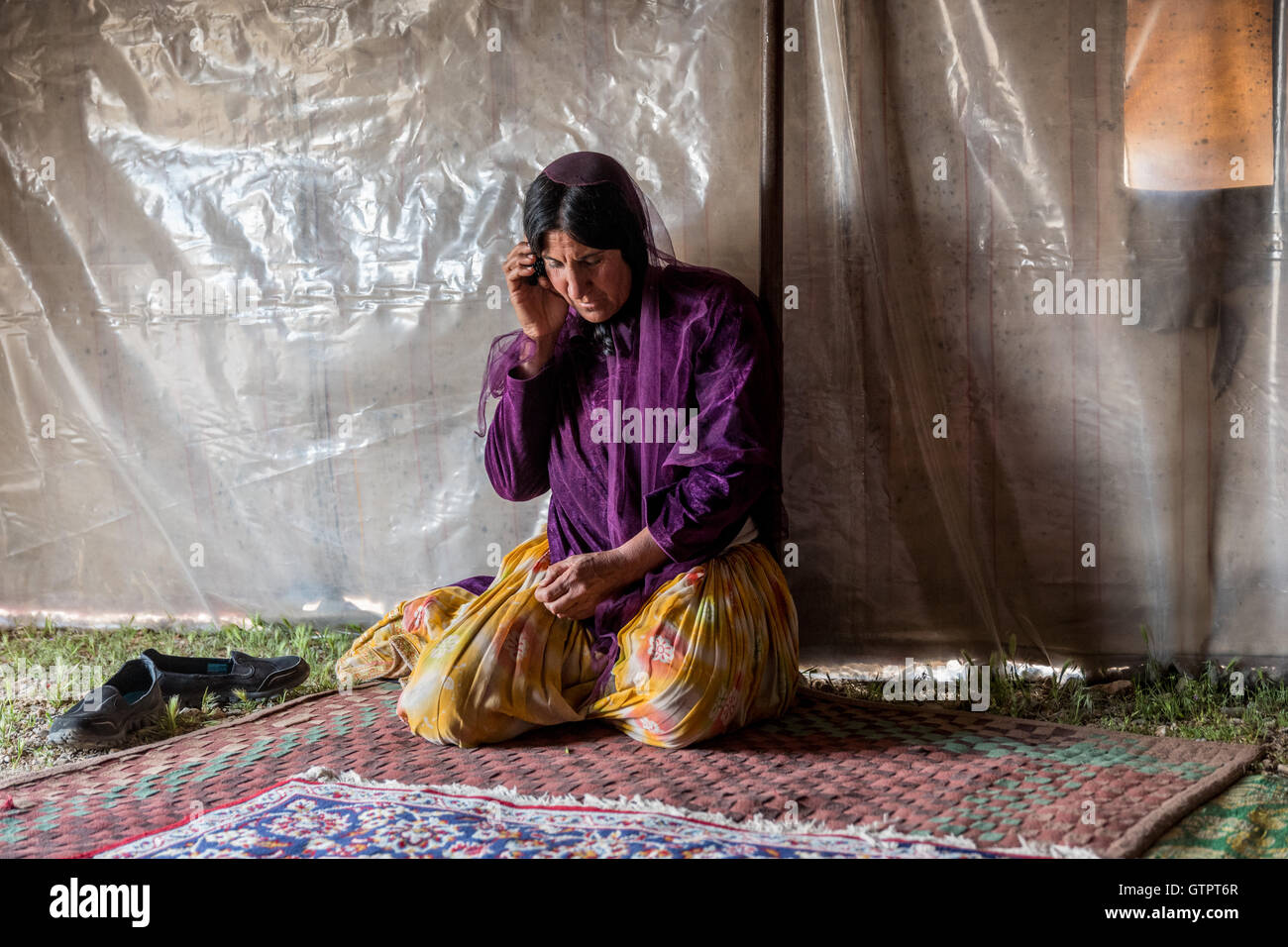 Khoram Gol, nomadic Basseri woman on her cell phone inside her family's ...