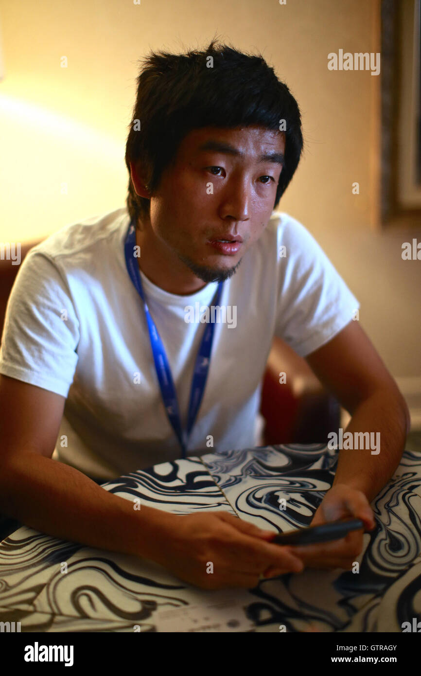 Venice. 8th Sep, 2016. Chinese director Hu Wei receives an interview ...