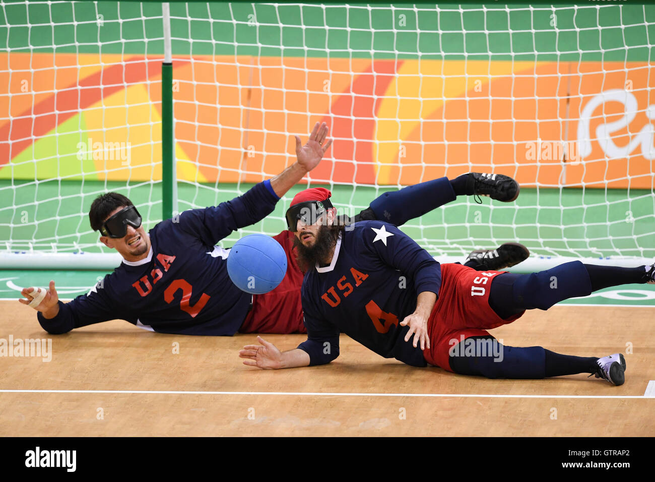 Tyler Merren (2) and John Kusku (4) block a shot by China in men's ...