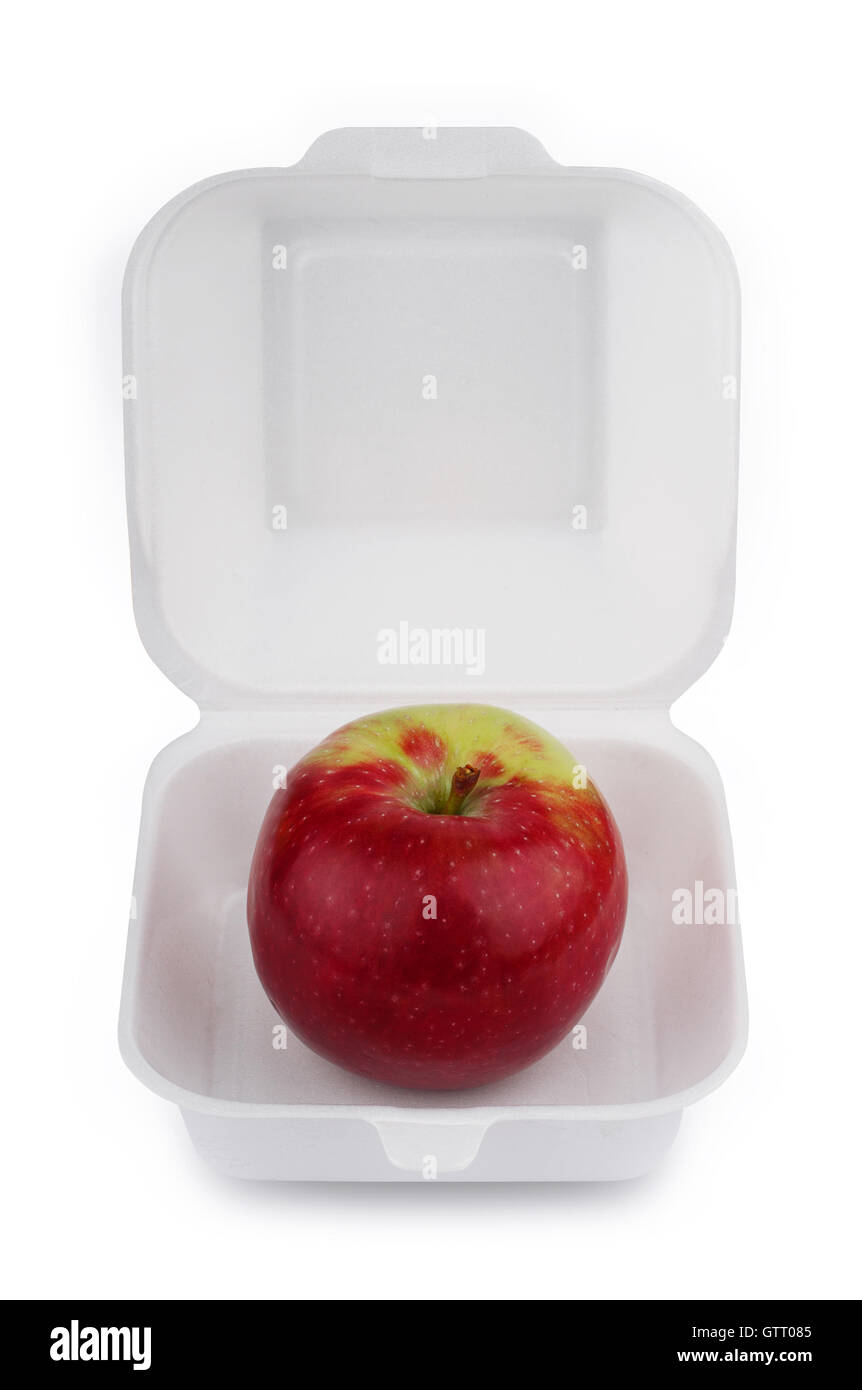 front view of a red apple on open empty white meal foam tray pack ...