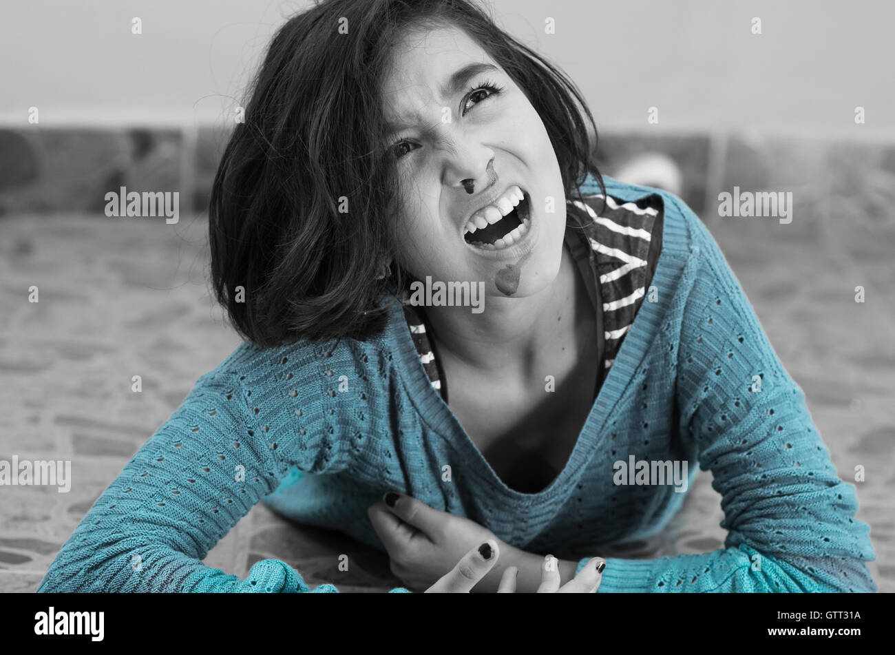 pretty young girl with a bleeding nose after falling down Stock Photo ...