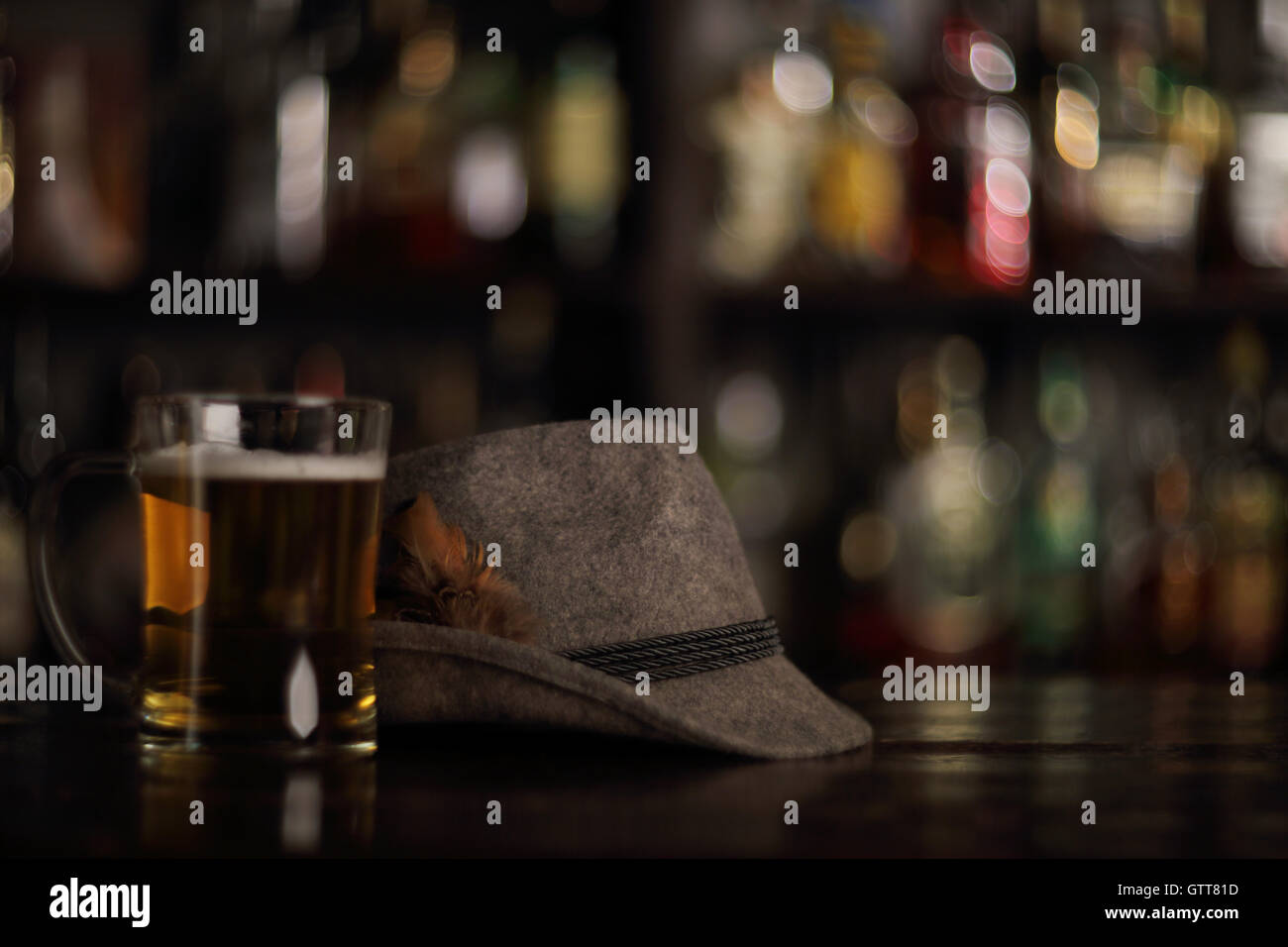 Oktoberfest beer in glass mug and german hat in bar Stock Photo - Alamy