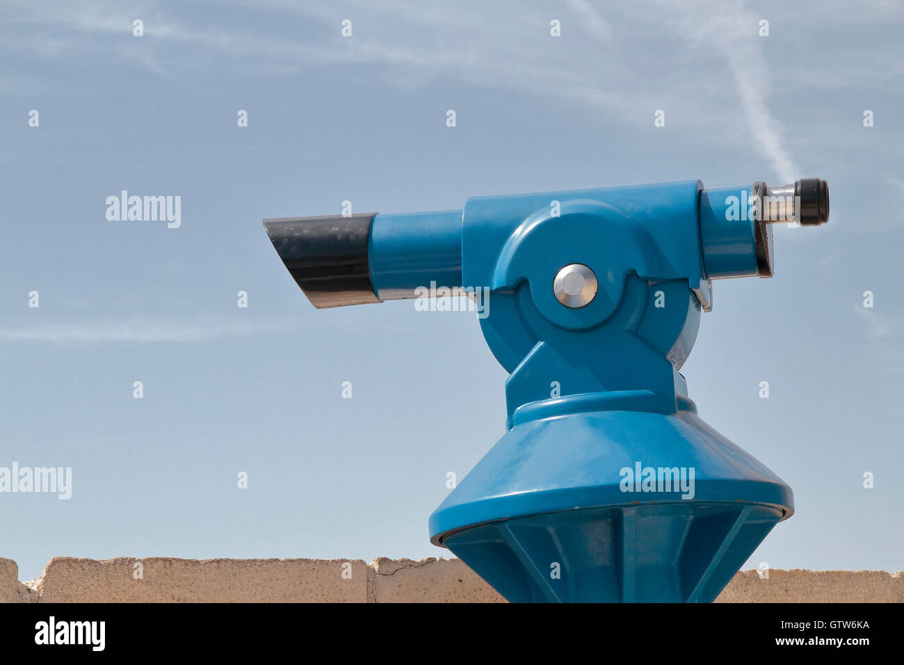 foreground of a blue panoramic telescope with the sky as background ...