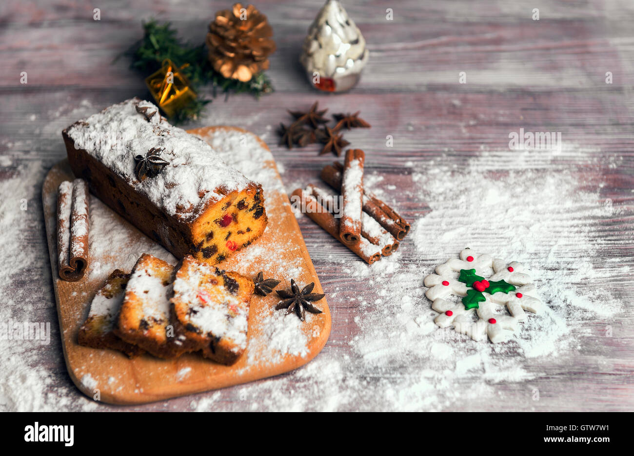 On a wooden desk background Christmas stollen Stollen, a Christmas tree ...