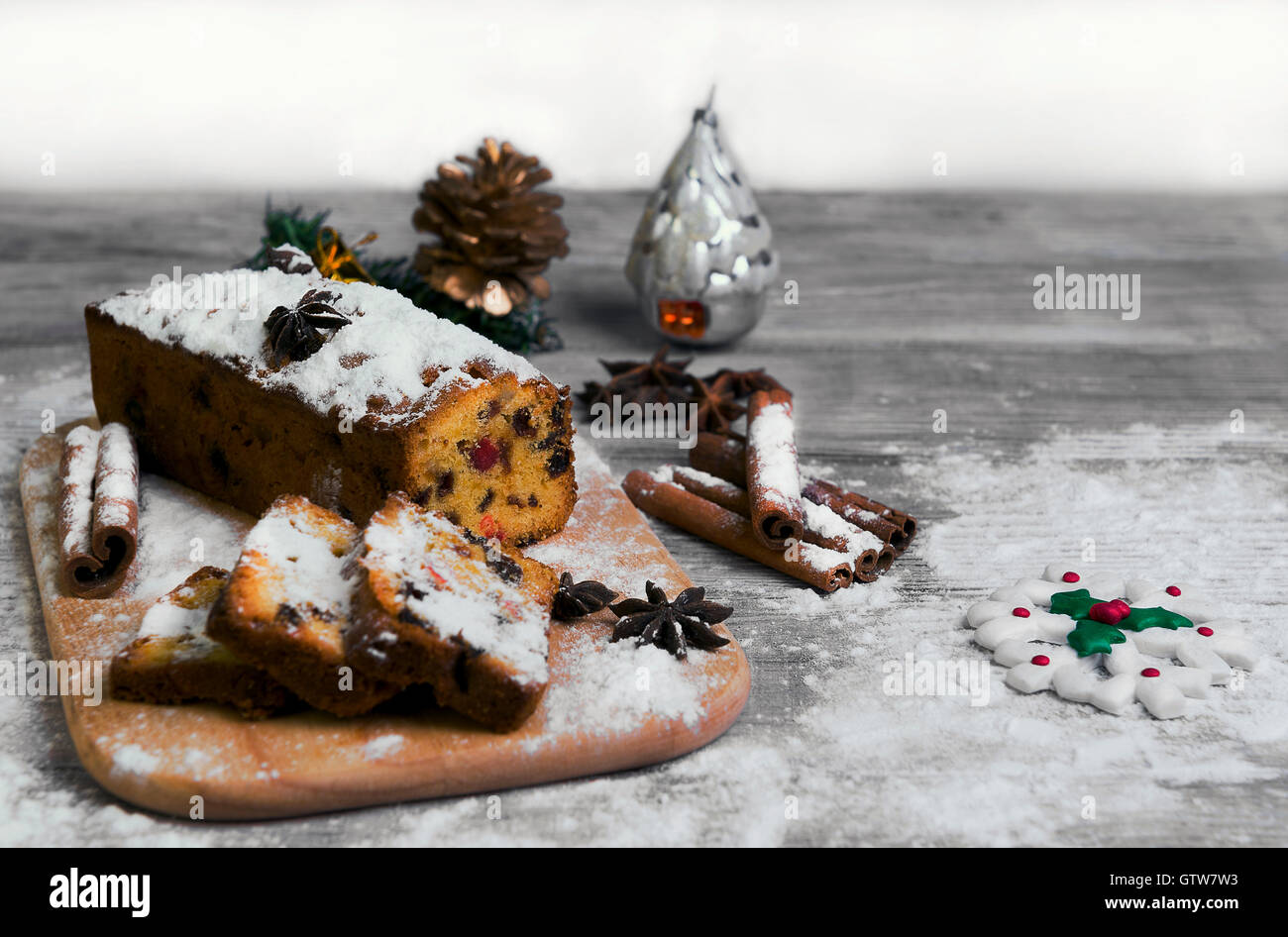 On a wooden desk background Christmas stollen Stollen, a Christmas tree ...