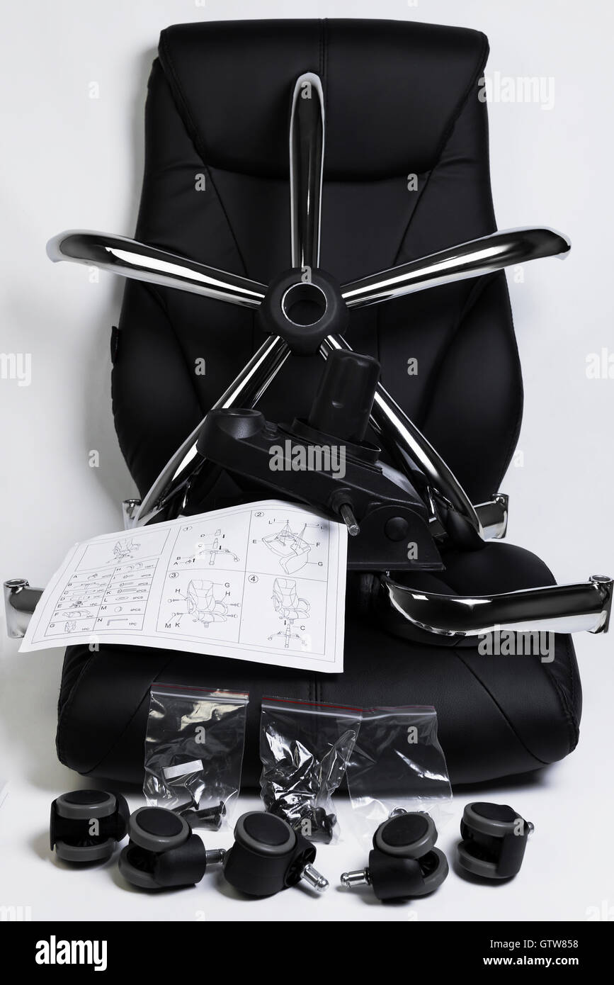 a complete set of components for assembly of an office chair on a white ...