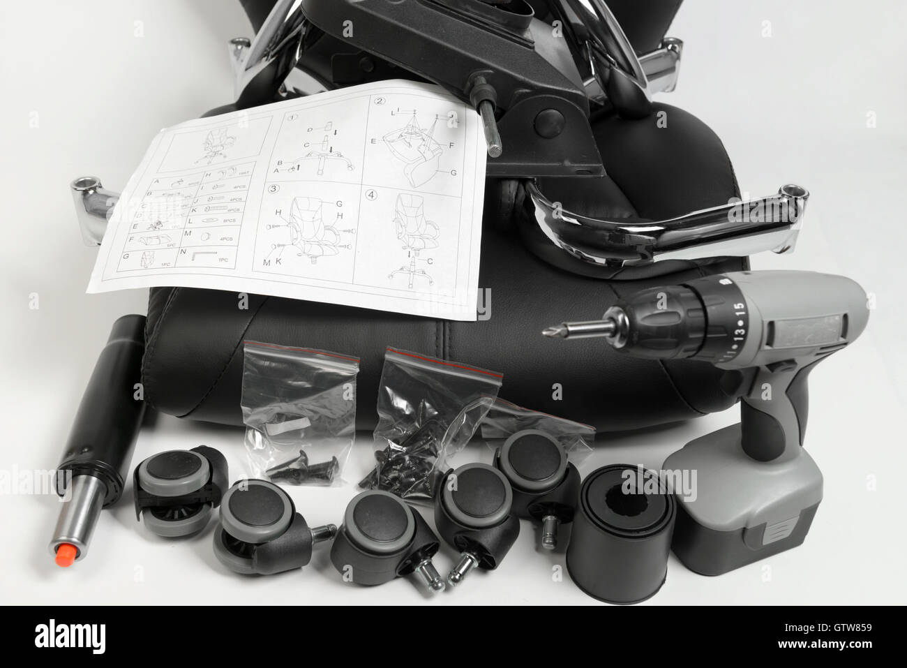 a complete set of components for assembly of an office chair on a white ...