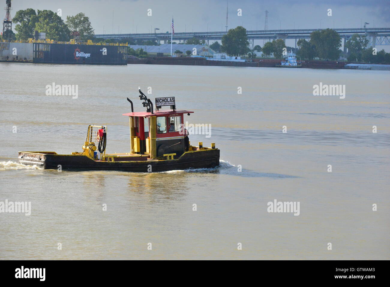 A small cabin boat moving up the Mississippi towards New Orleans Stock ...