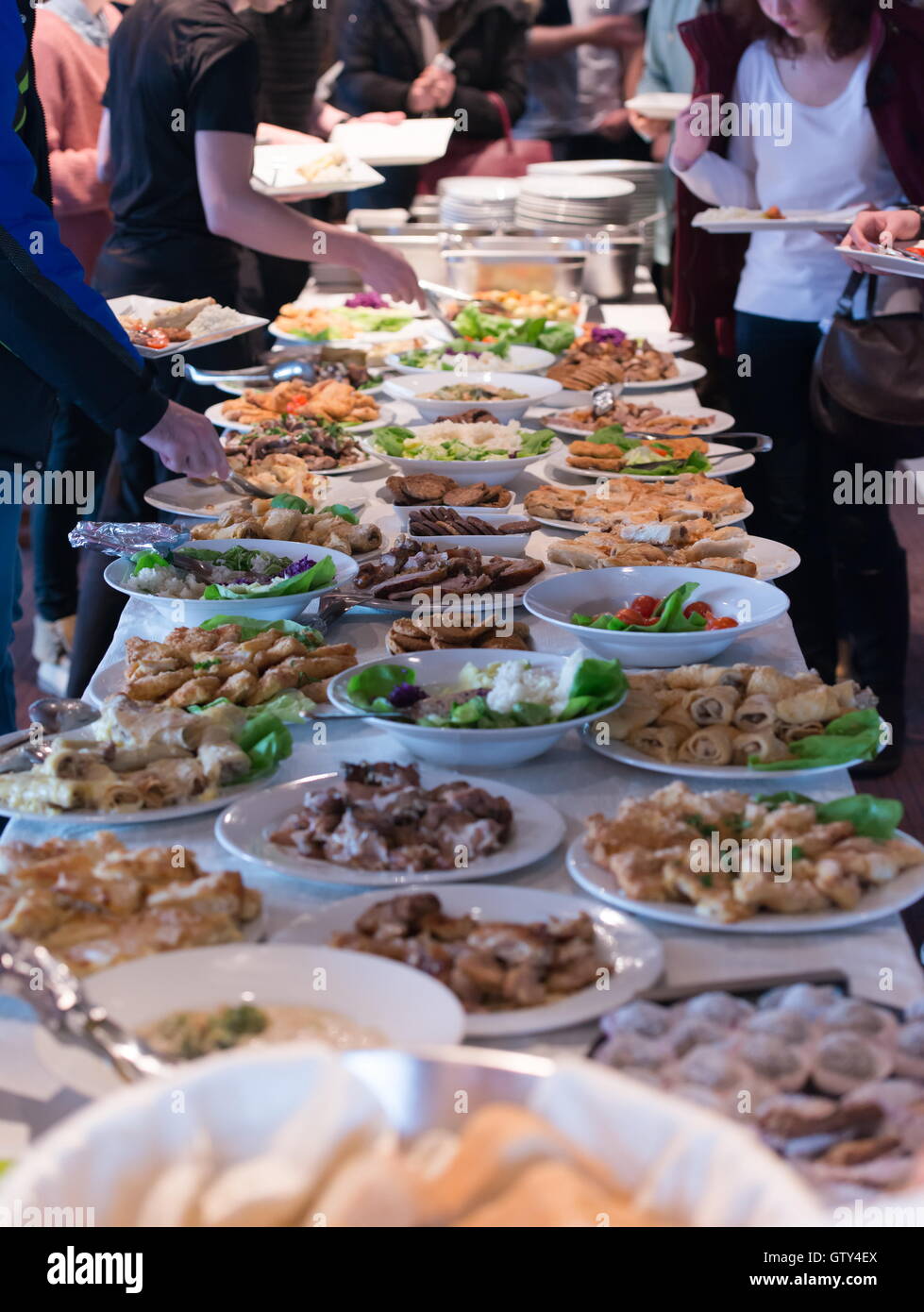 people group catering buffet food indoor in school restaurant with meat ...