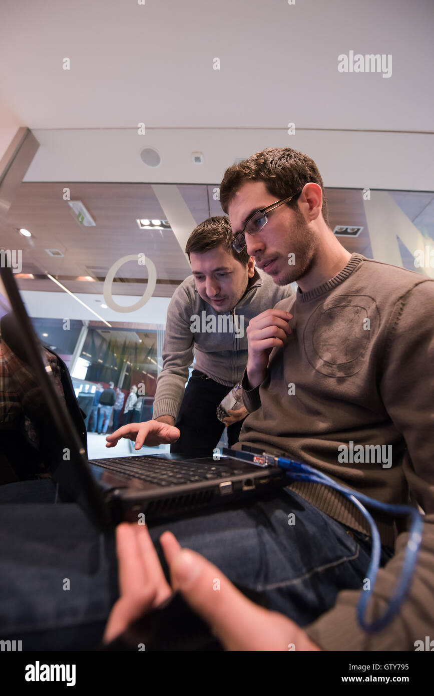 young computer technology students on code programming class have ...