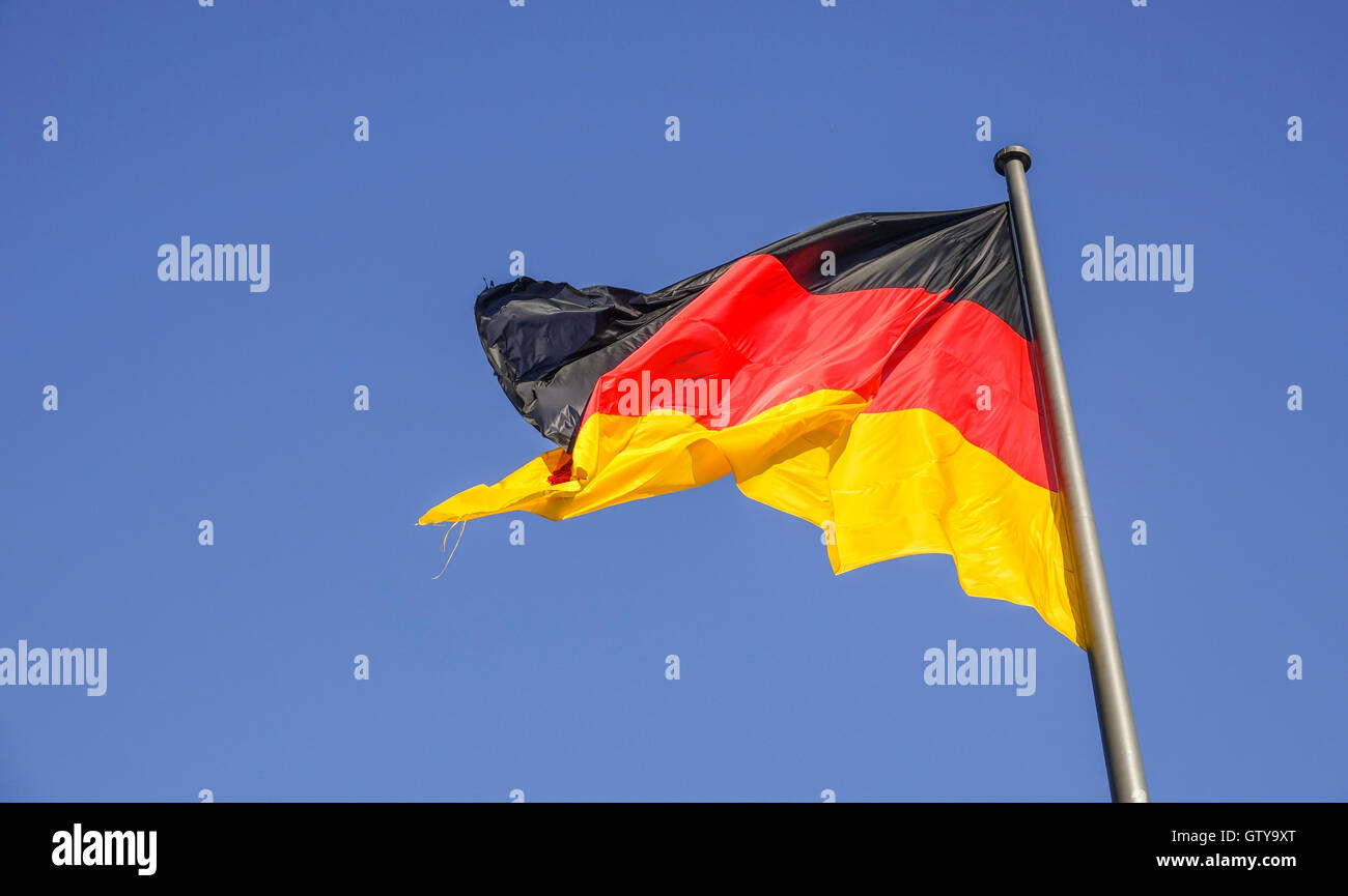 German Flag waving in the wind Stock Photo - Alamy