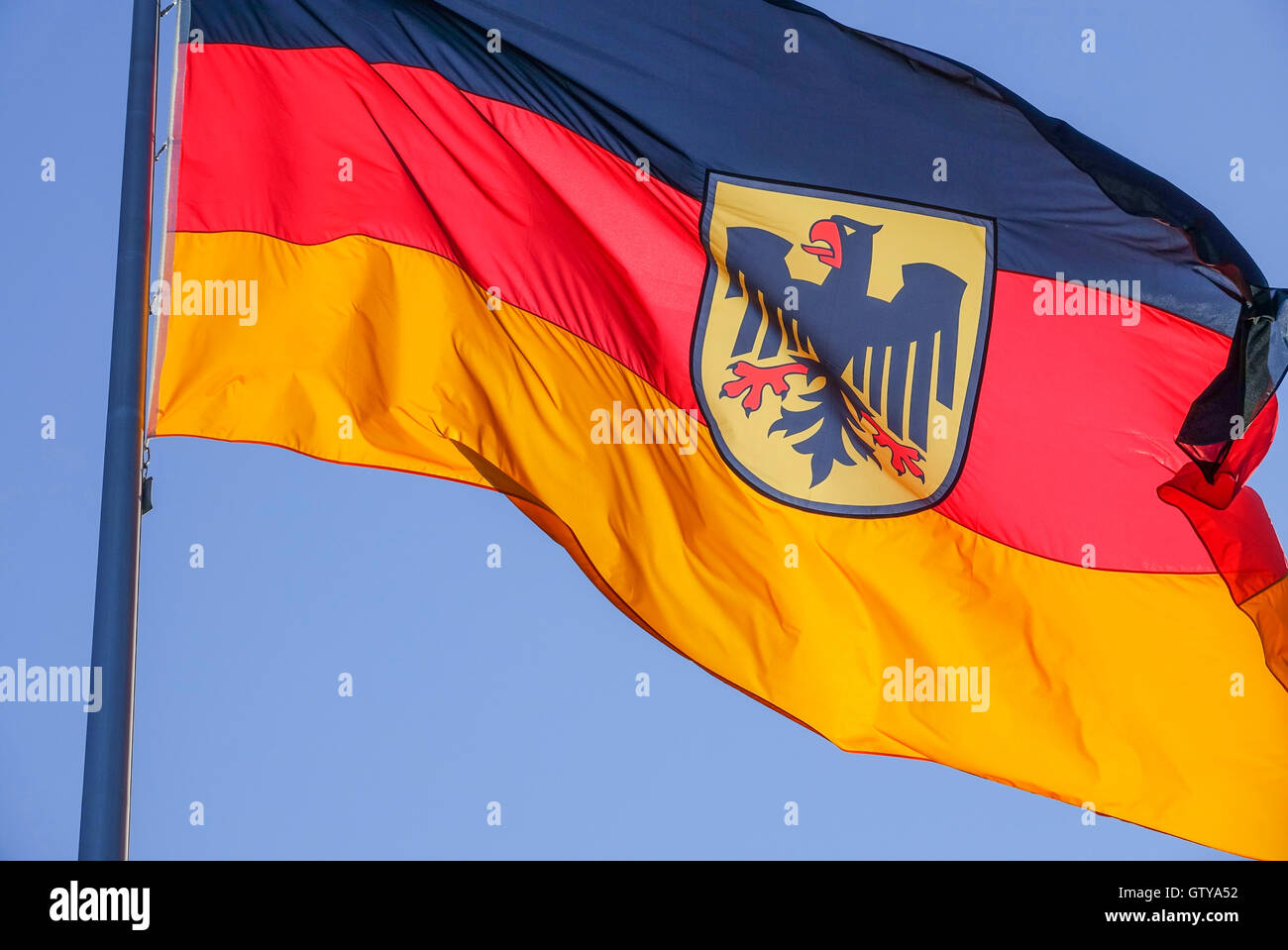 German Flag waving in the wind Stock Photo - Alamy