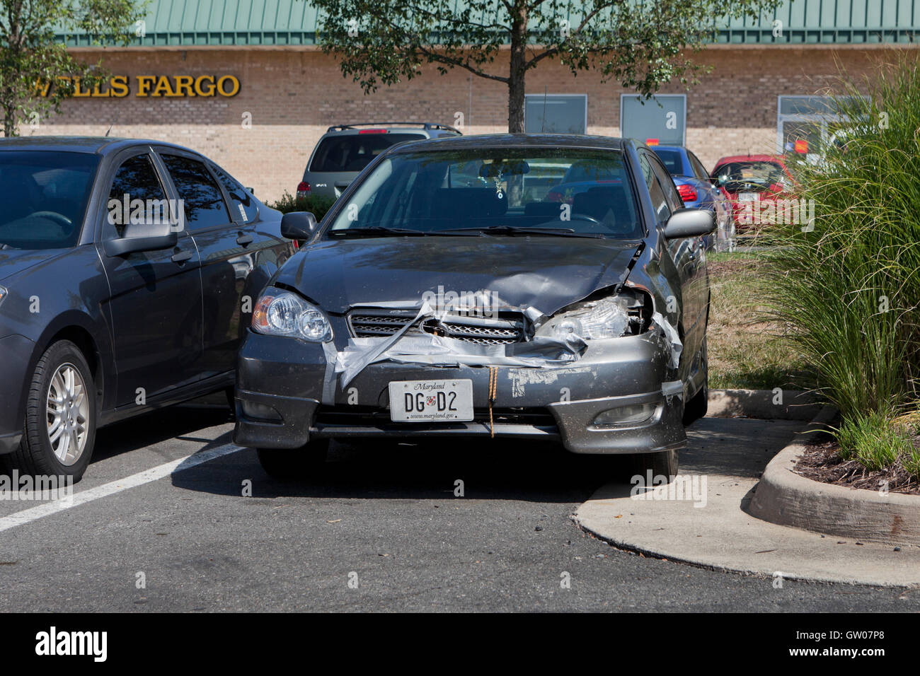 Frontal accident damage of compact Japanese car - USA Stock Photo - Alamy