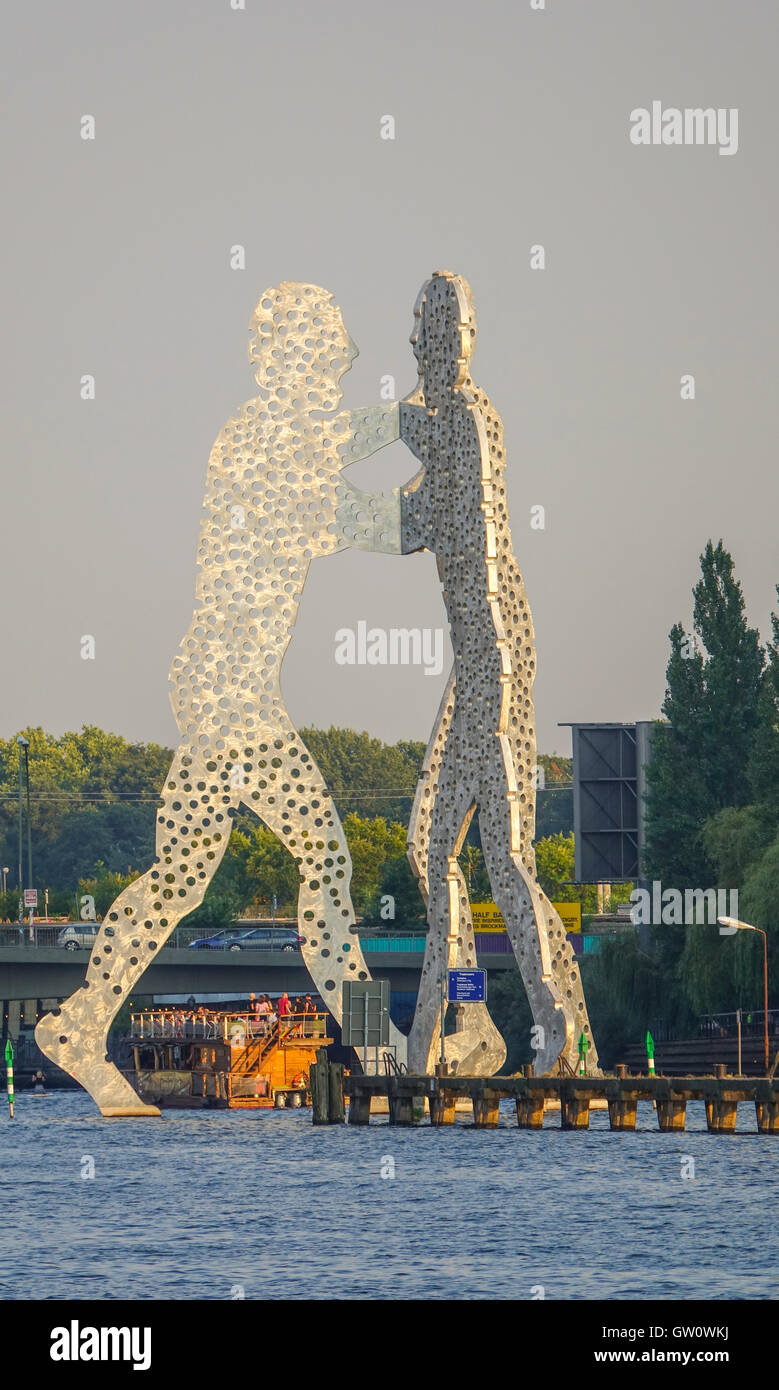 The huge Molecule Men Statue on River Spree in Berlin Stock Photo - Alamy