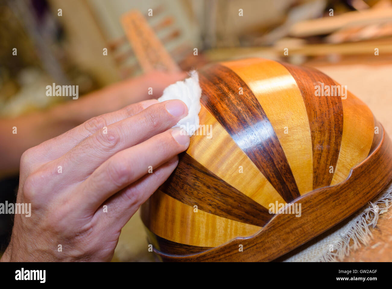 Hand polishing musical instrument Stock Photo - Alamy