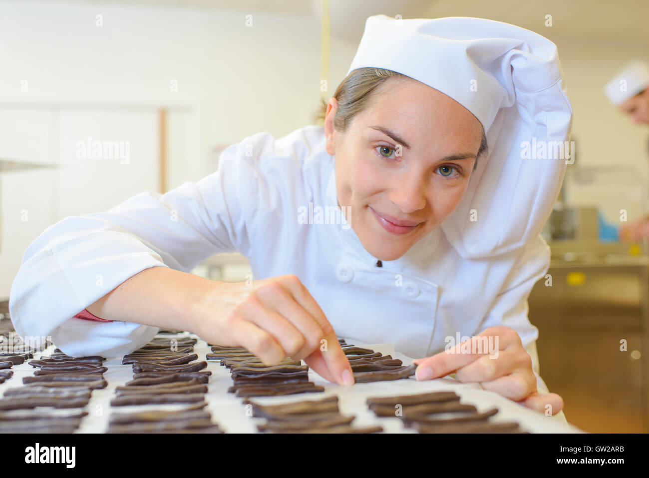 Chef arranging chocolates Stock Photo - Alamy