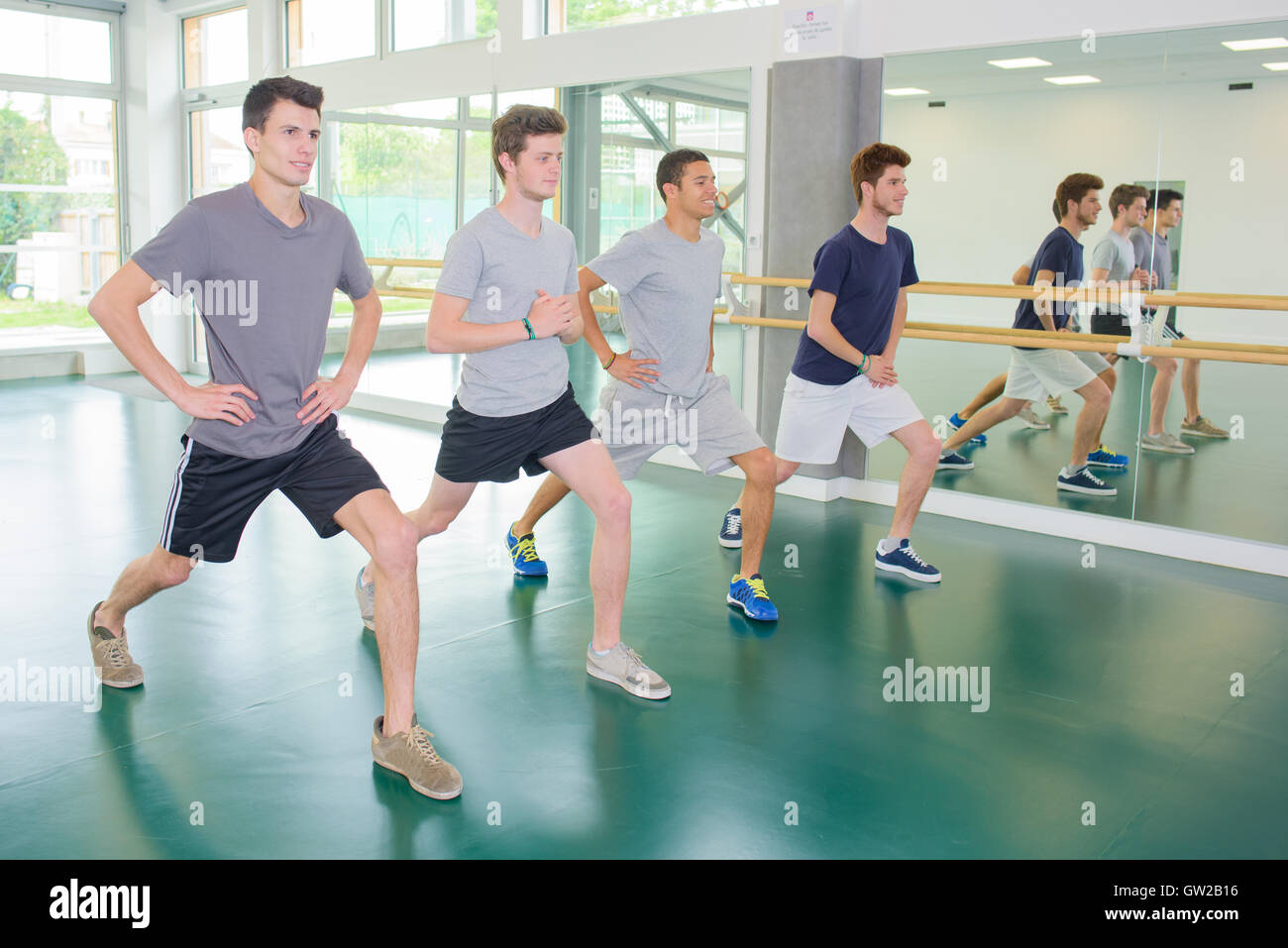 young men stretching Stock Photo - Alamy