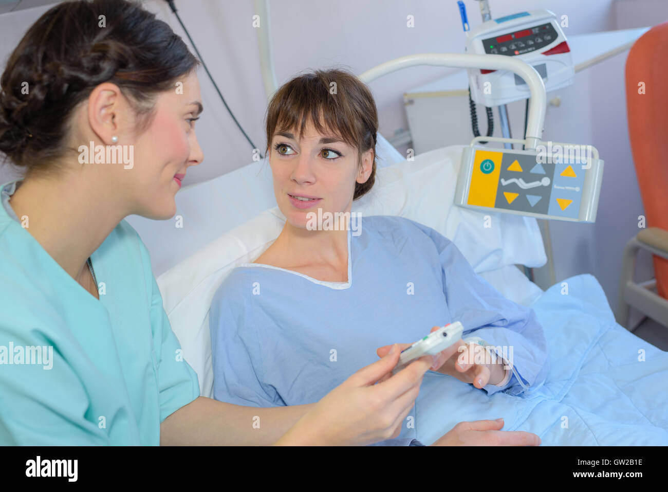 Nurse with female patient Stock Photo - Alamy