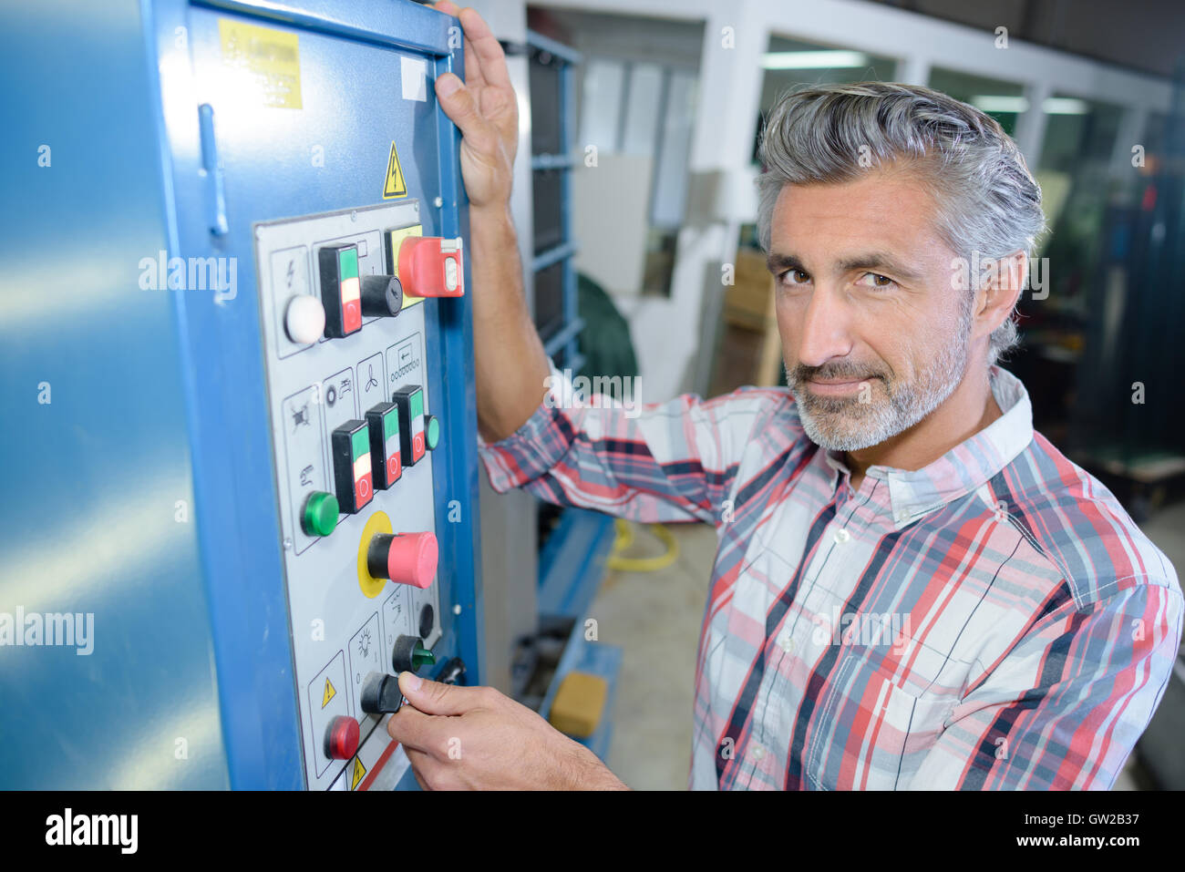 tending the machine Stock Photo - Alamy