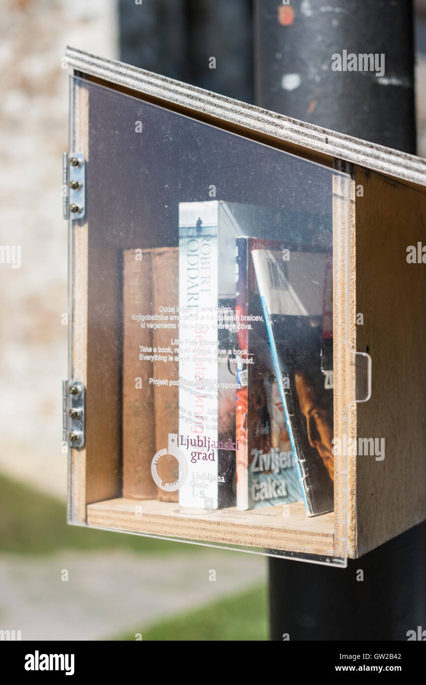 a small free library in an outdoor box Stock Photo - Alamy