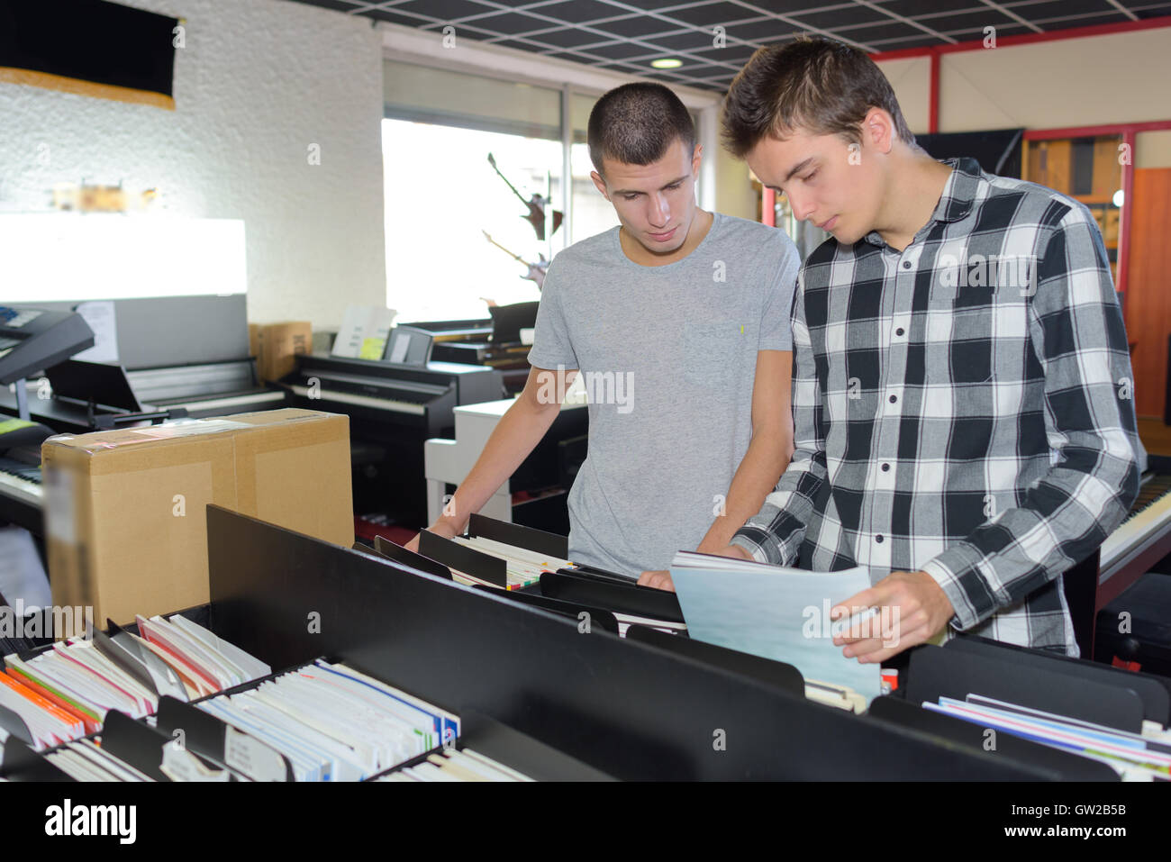 men on a room of folders Stock Photo - Alamy